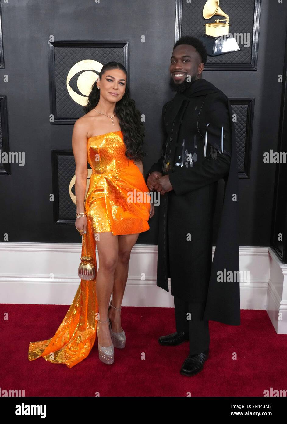 Sabrina Harrison, left, and Dante Bowe arrive at the 65th annual Grammy ...