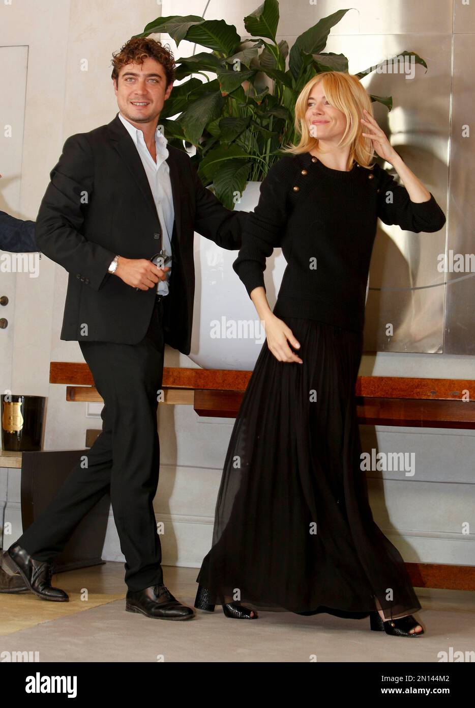 Actors from left, Sienna Miller and Riccardo Scamarcio pose at the ...