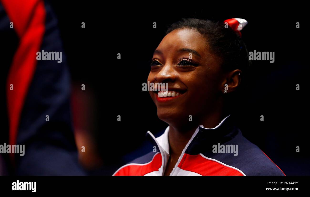 Simone Biles of the U.S. smiles as she waits for the start at the women ...
