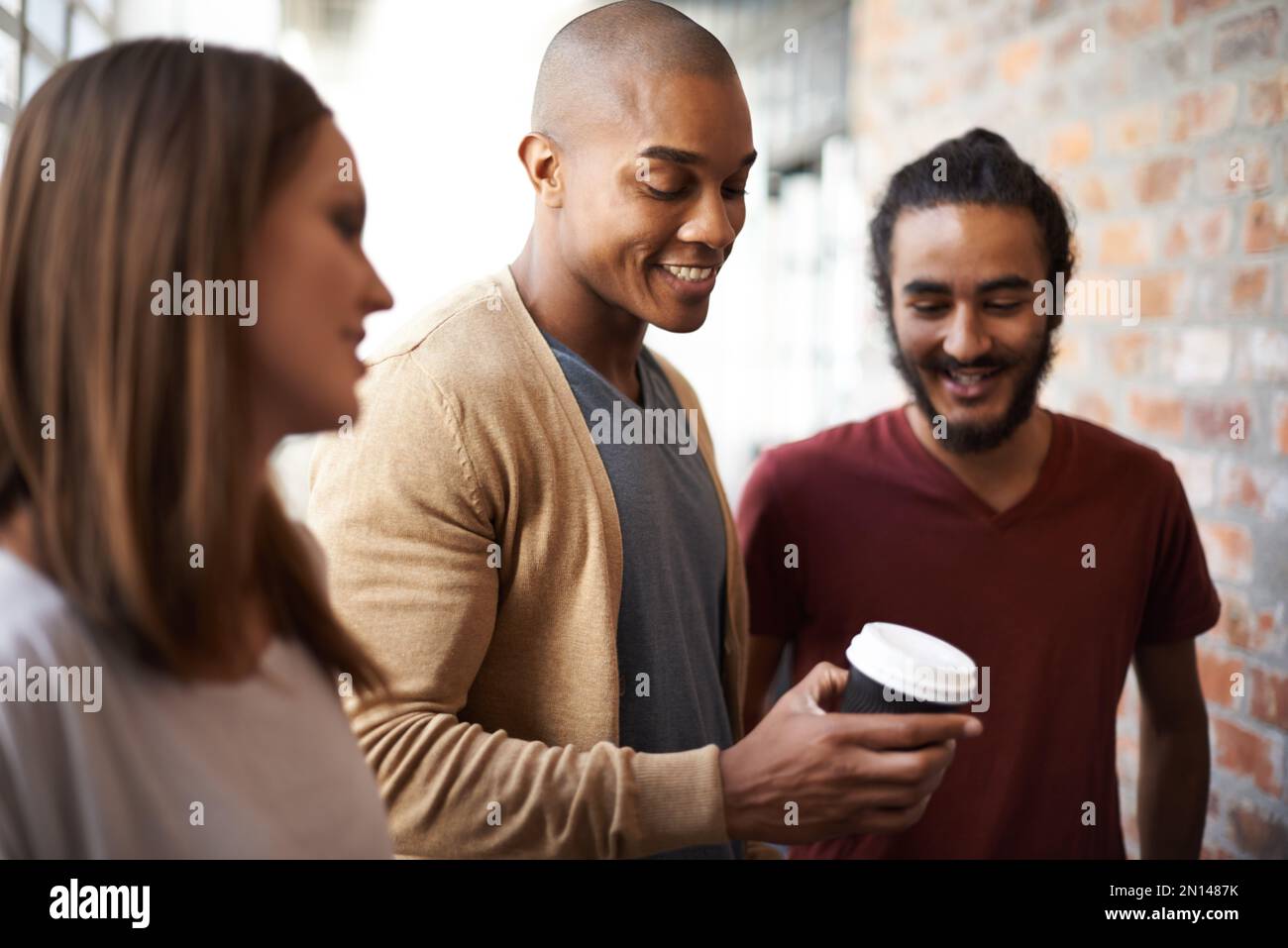 Grabbing a quick coffee and a chat. a diverse group of friends hanging ...