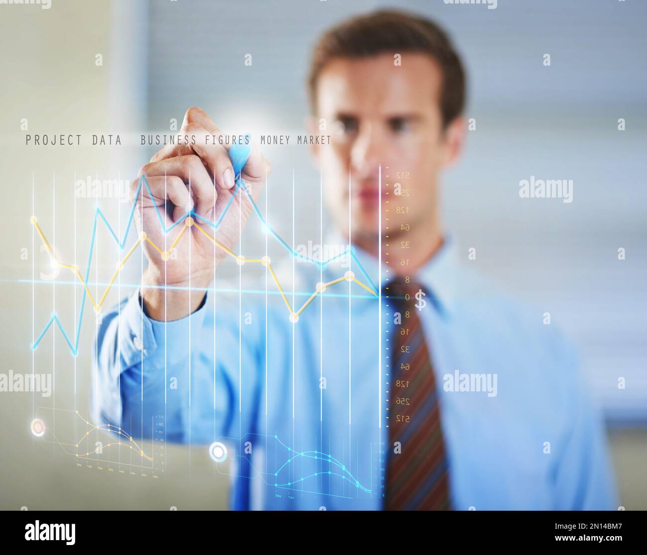 Plotting the future of business. a handsome young businessman drawing a ...