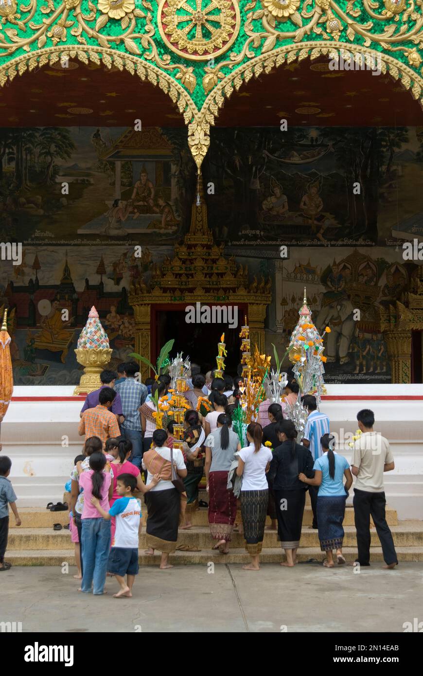 Novice monks in ceremony with family & friends carrying offerings ...