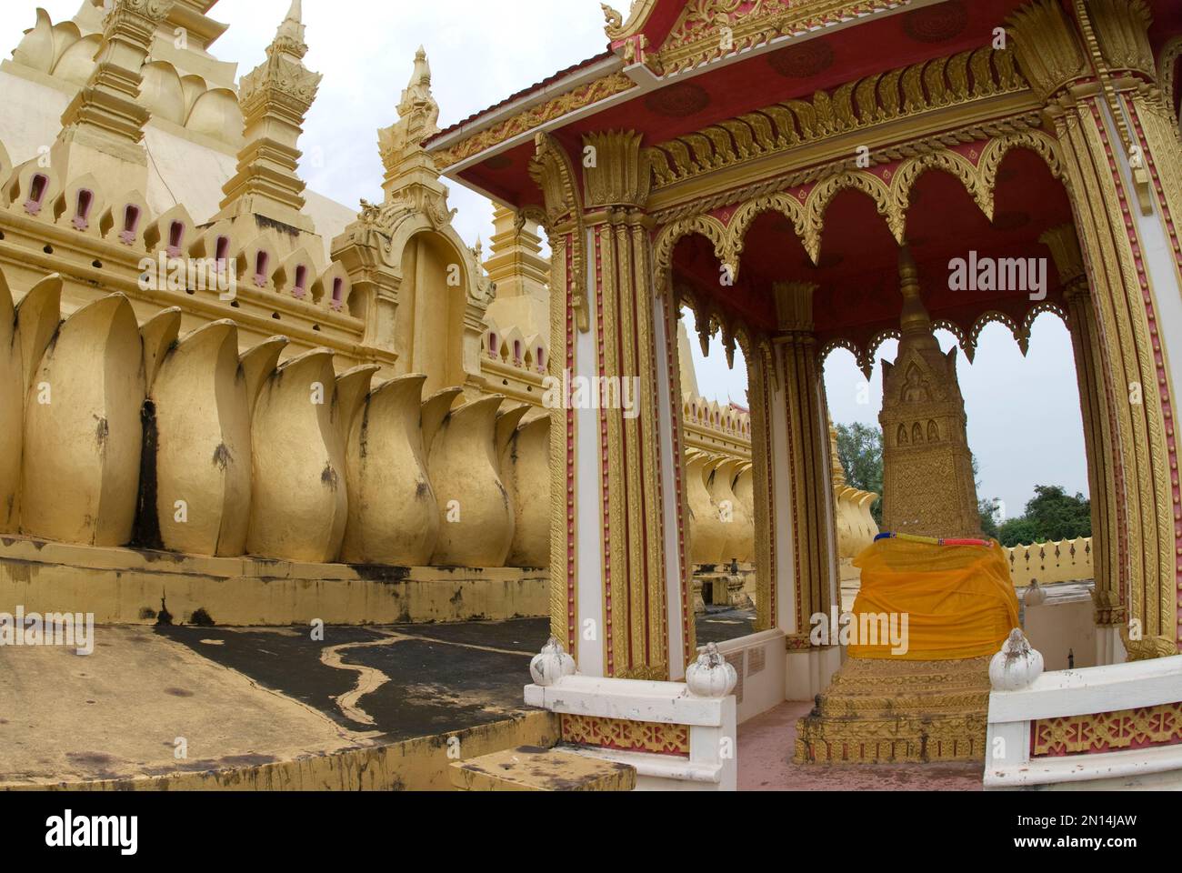 Holy golden object wrapped in gold cloth in small temple, Pha That ...