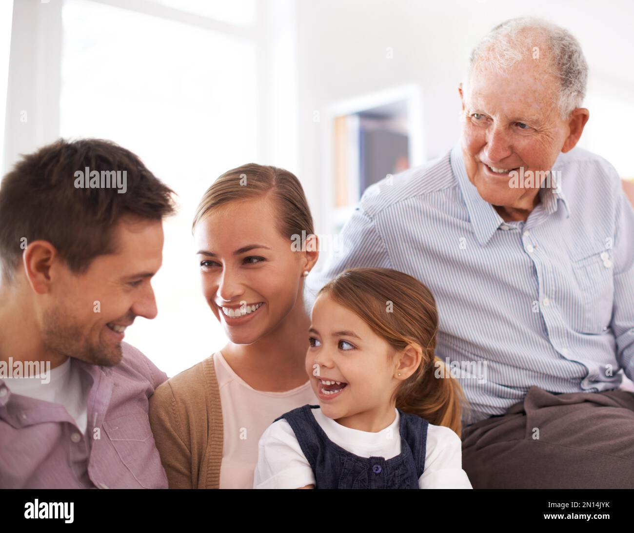 Bonding like a family should. a smiling three-generational family ...