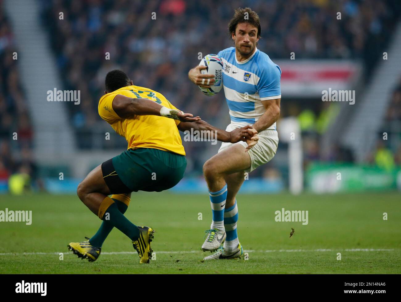 Australia's Tevita Kuridrani, left, tackles Argentina's Marcelo Bosch ...