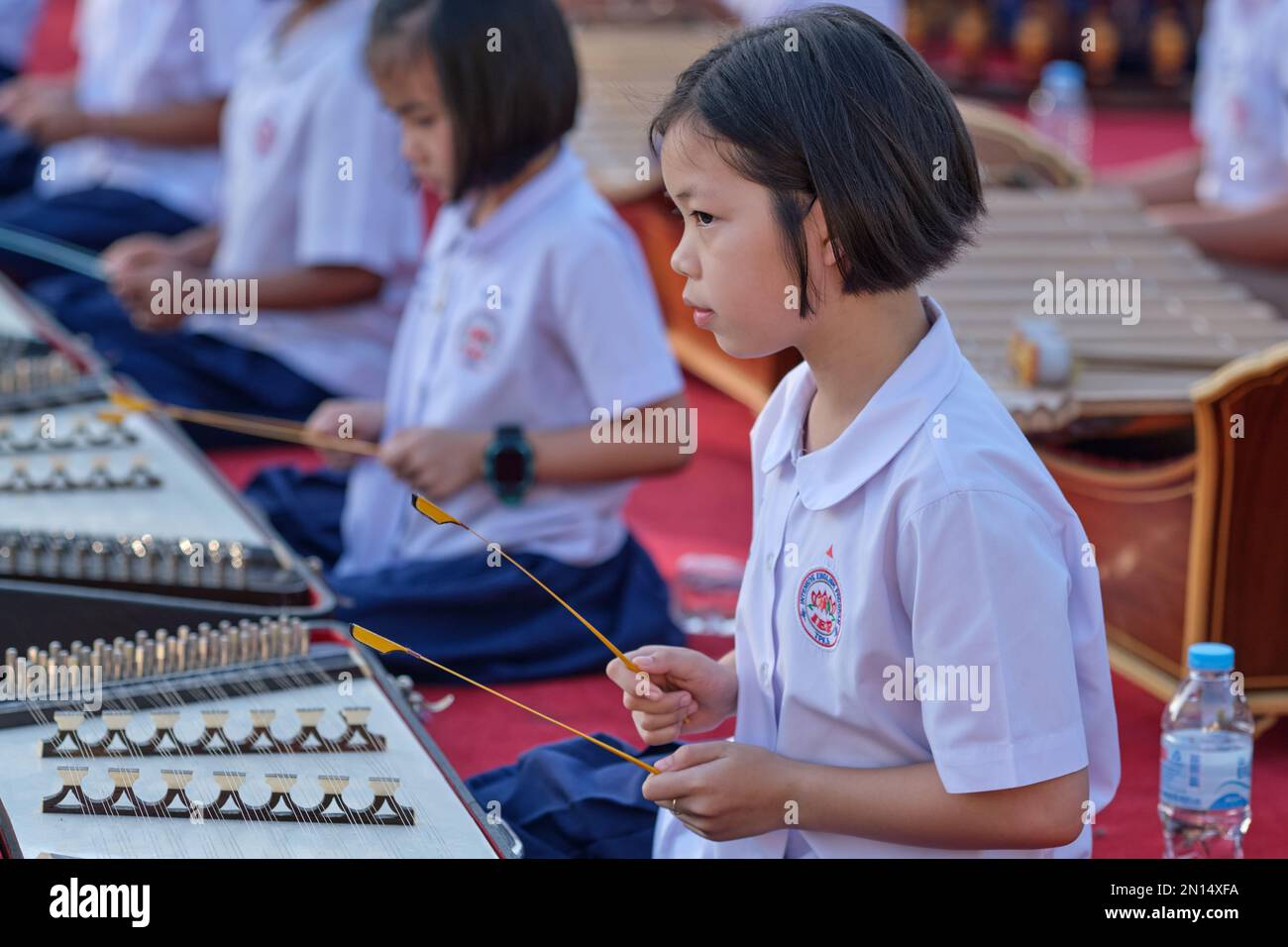 Thai school children during an opren-air performance of traditional ...