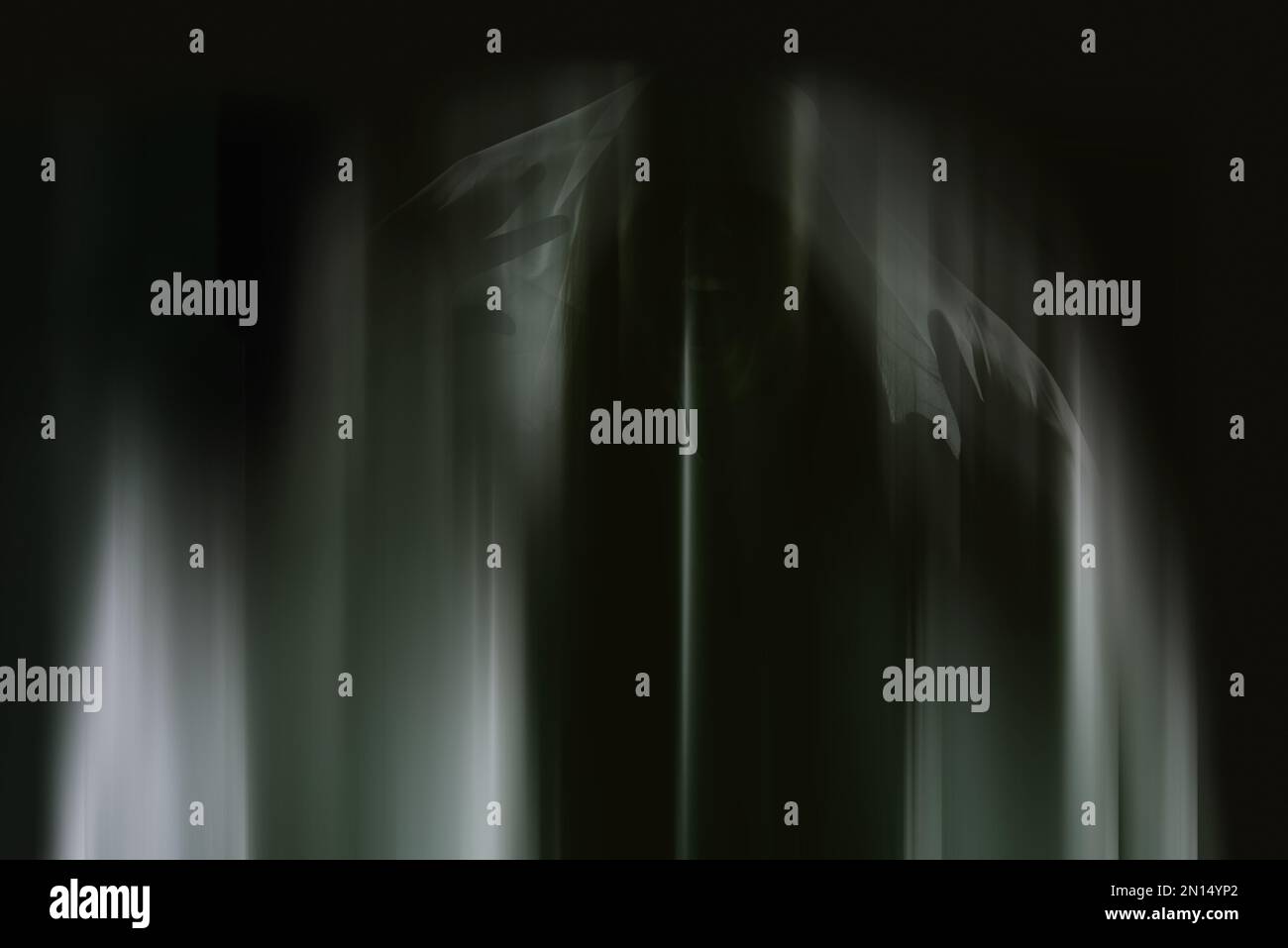 A haunting scene. A ghostly apparition of a woman isolated on a black ...