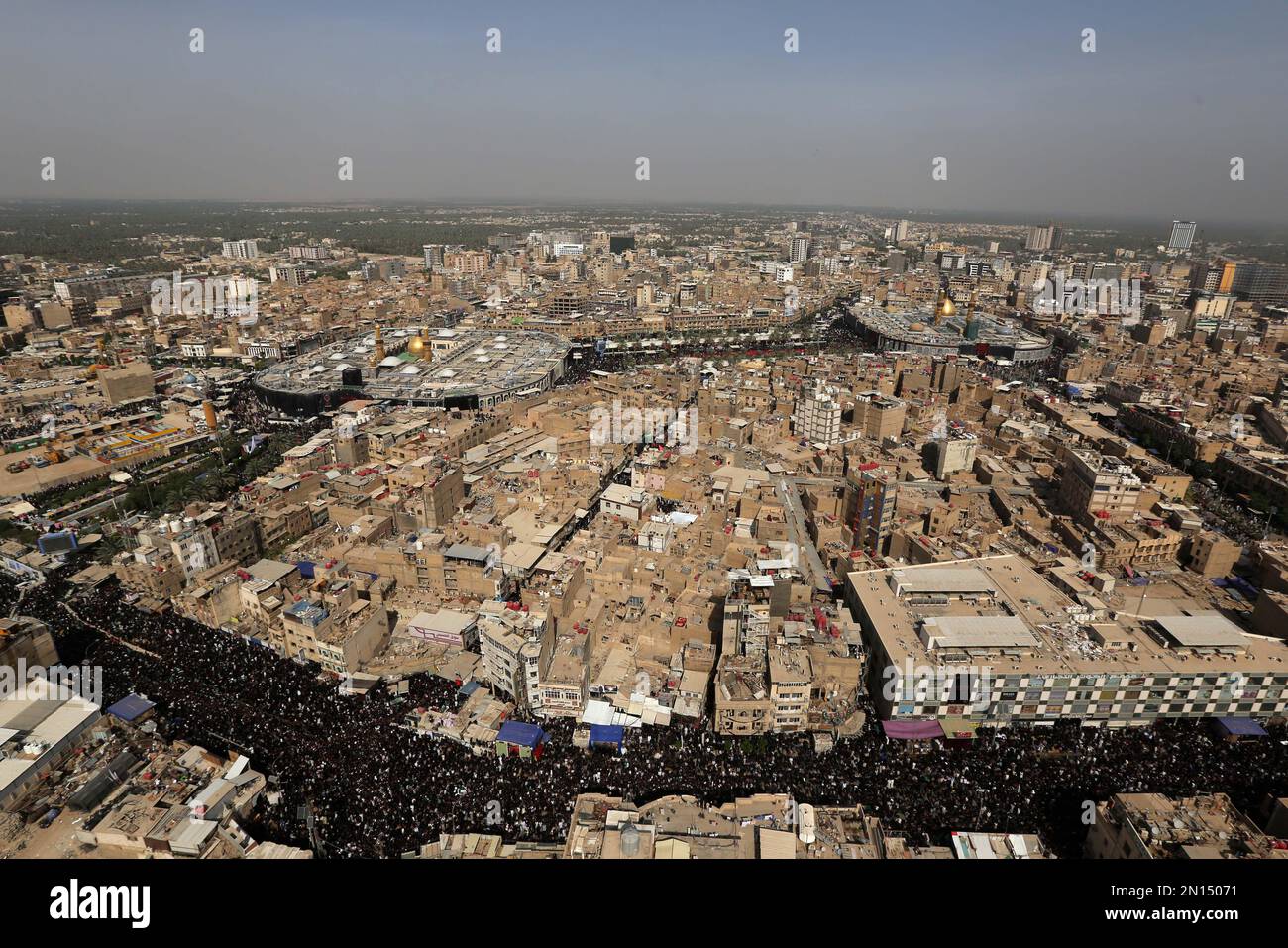 This aerial photo shows Shiite faithful pilgrims gathered between, the ...