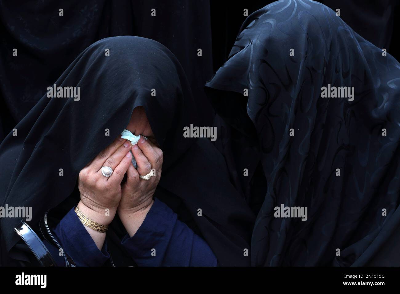 Iranian mourners weep as they attend Ashoura rituals in southern Tehran ...