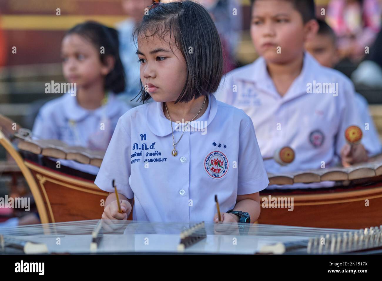 Thai school children during an opren-air performance of traditional ...