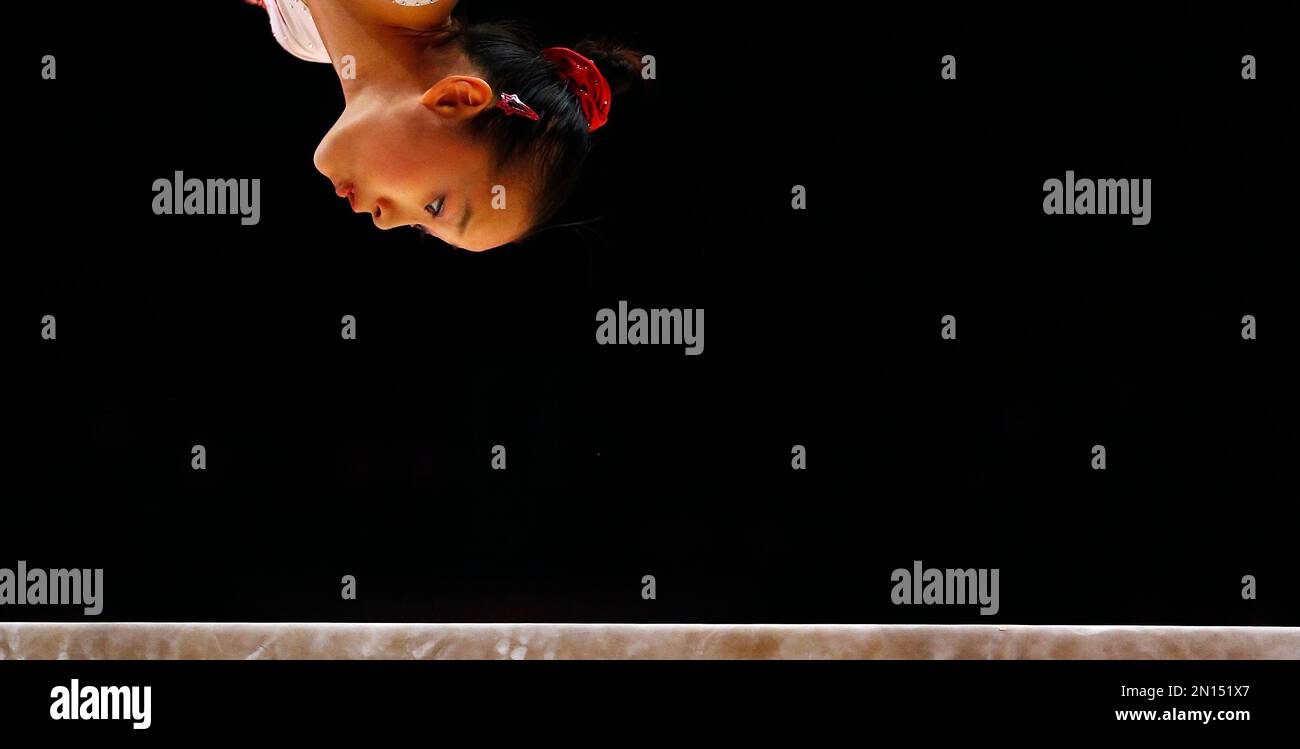 China's Yilin Fan performs during her beam routine as she takes part in ...