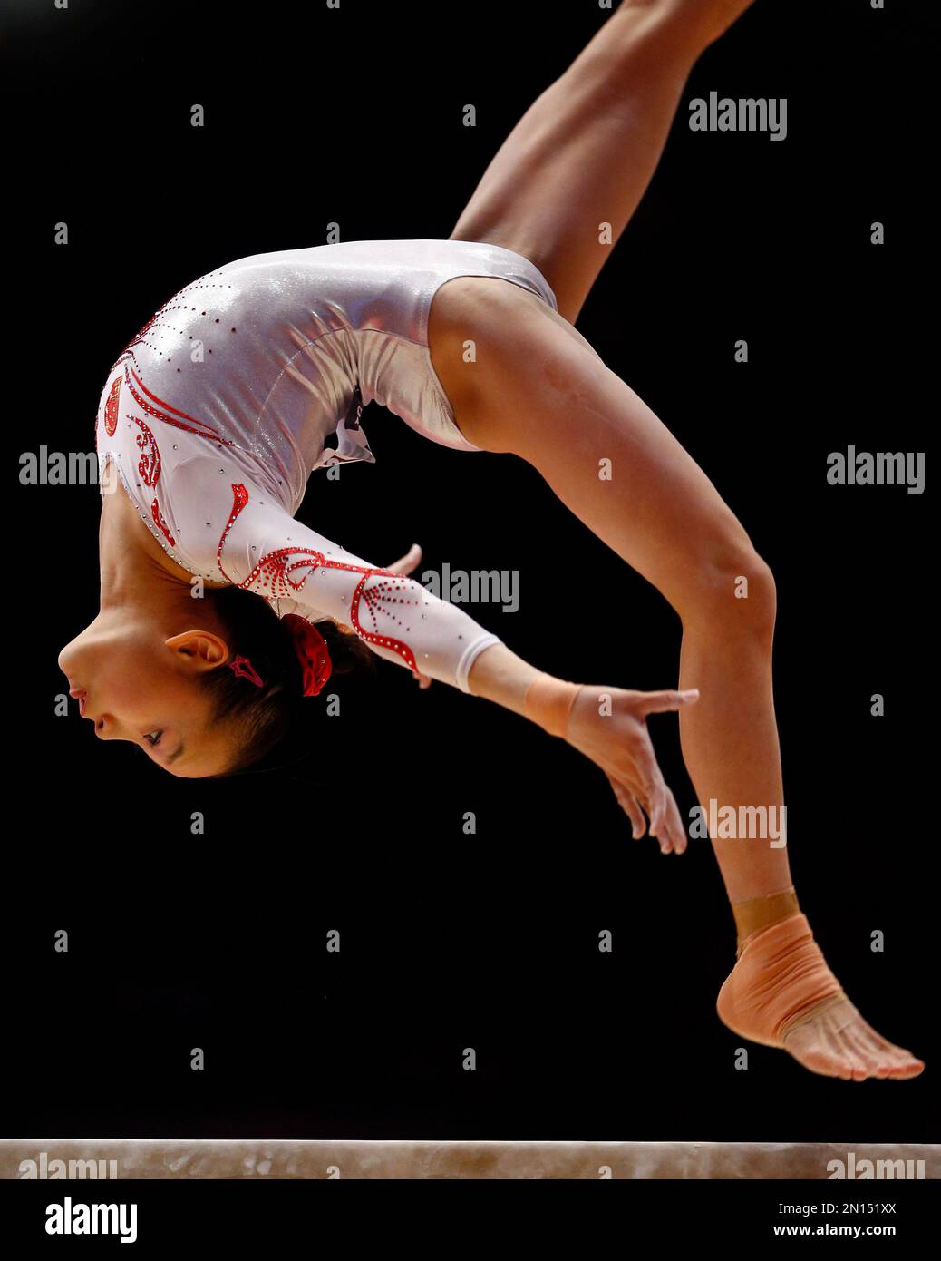 China's Yilin Fan performs during her beam routine as she takes part in ...