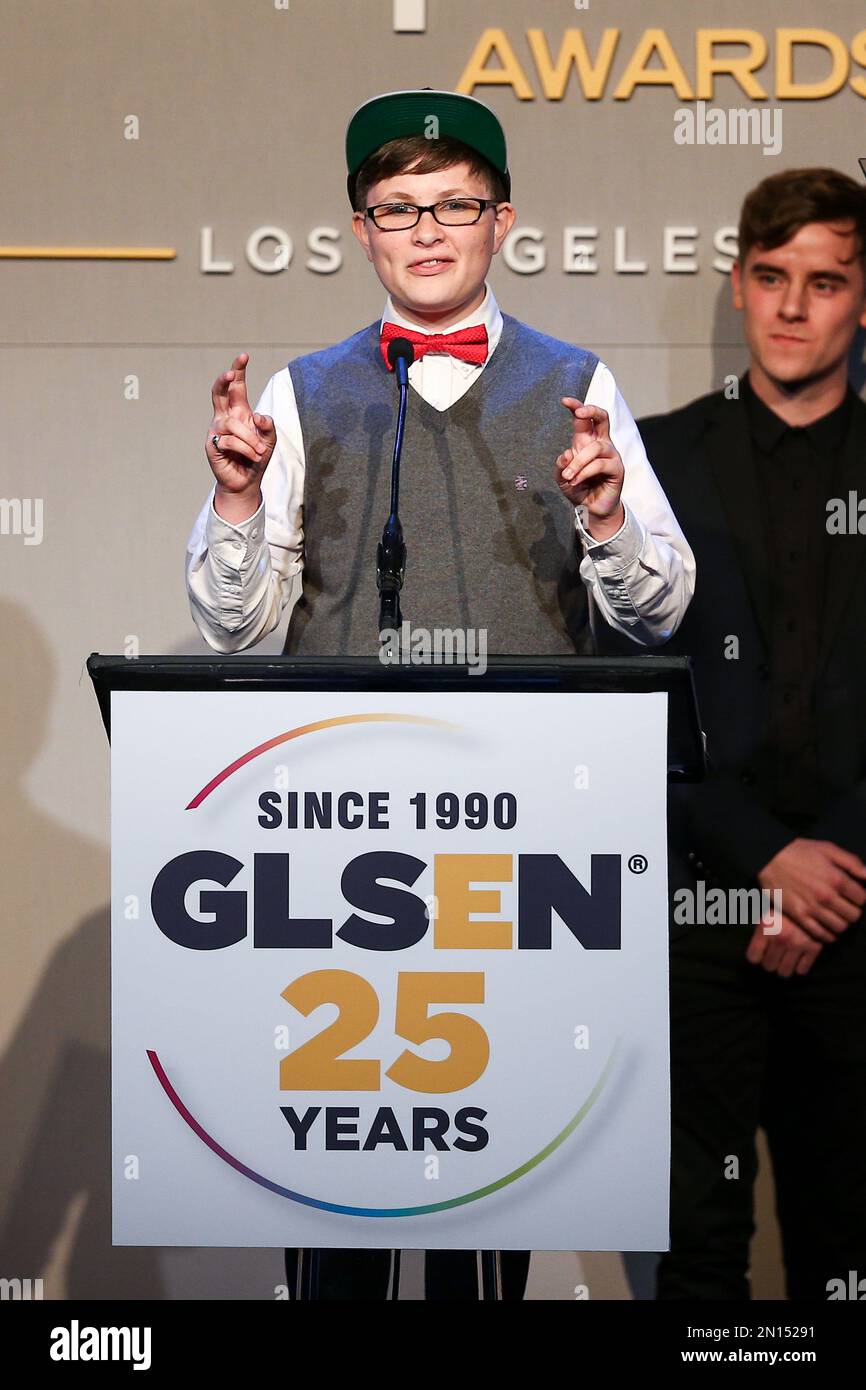 Honoree Mars Hallman accepts the Student Advocate of the Year Award ...