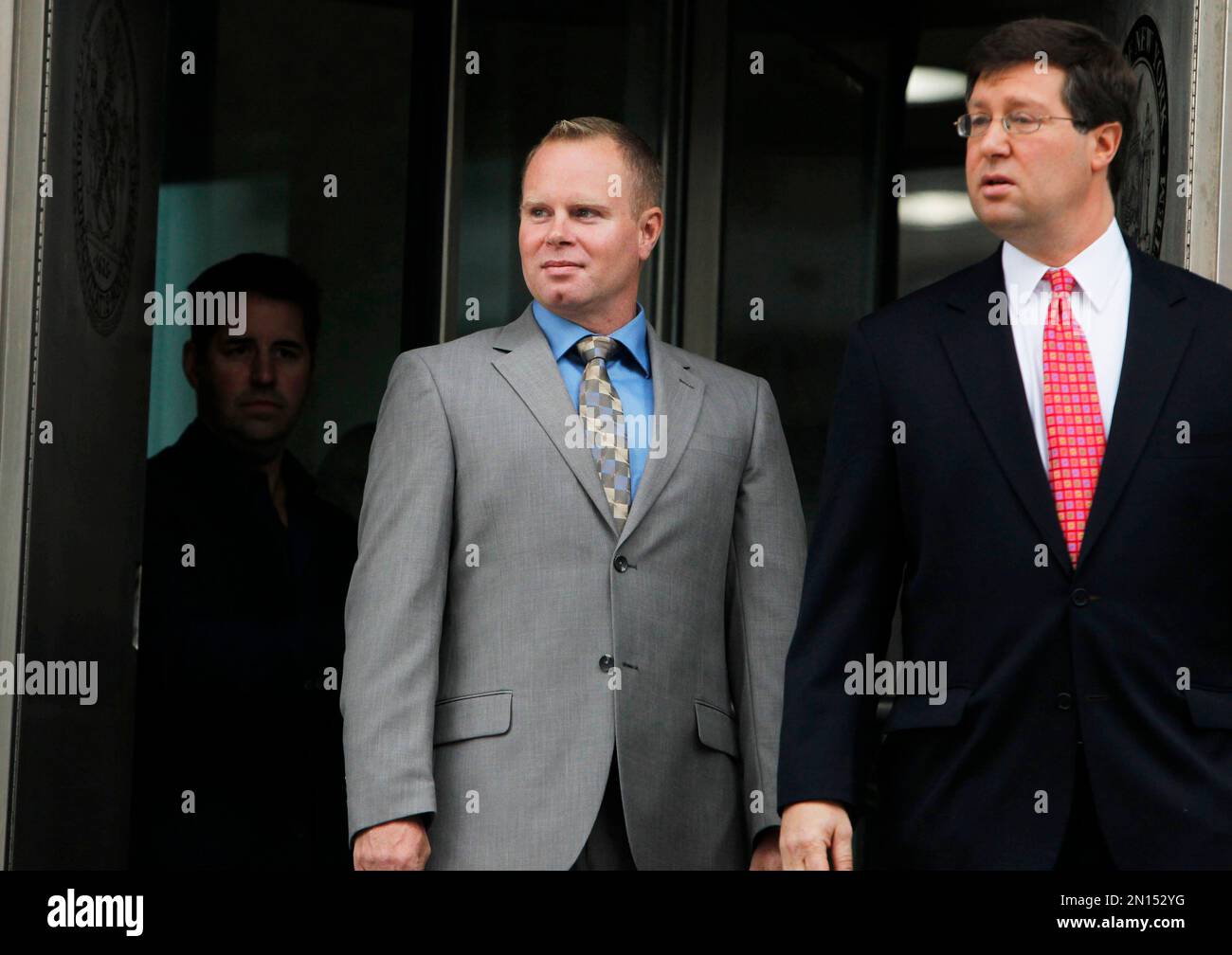 FILE - In this Oct. 19, 2010 file photo, Steven Slater, center, leaves ...