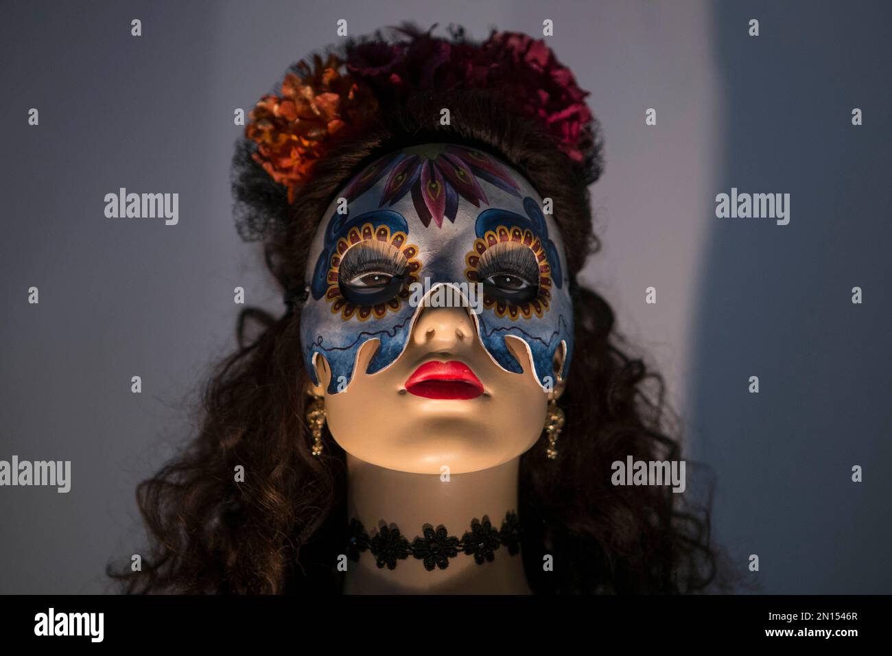 A mask used in the film "Spectre" is displayed at the exhibit ...