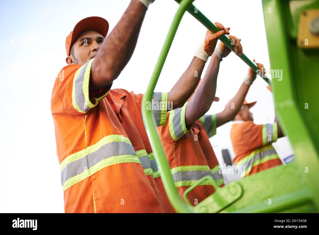 Theyre a dedicated team. a garbage collection team at work Stock Photo ...