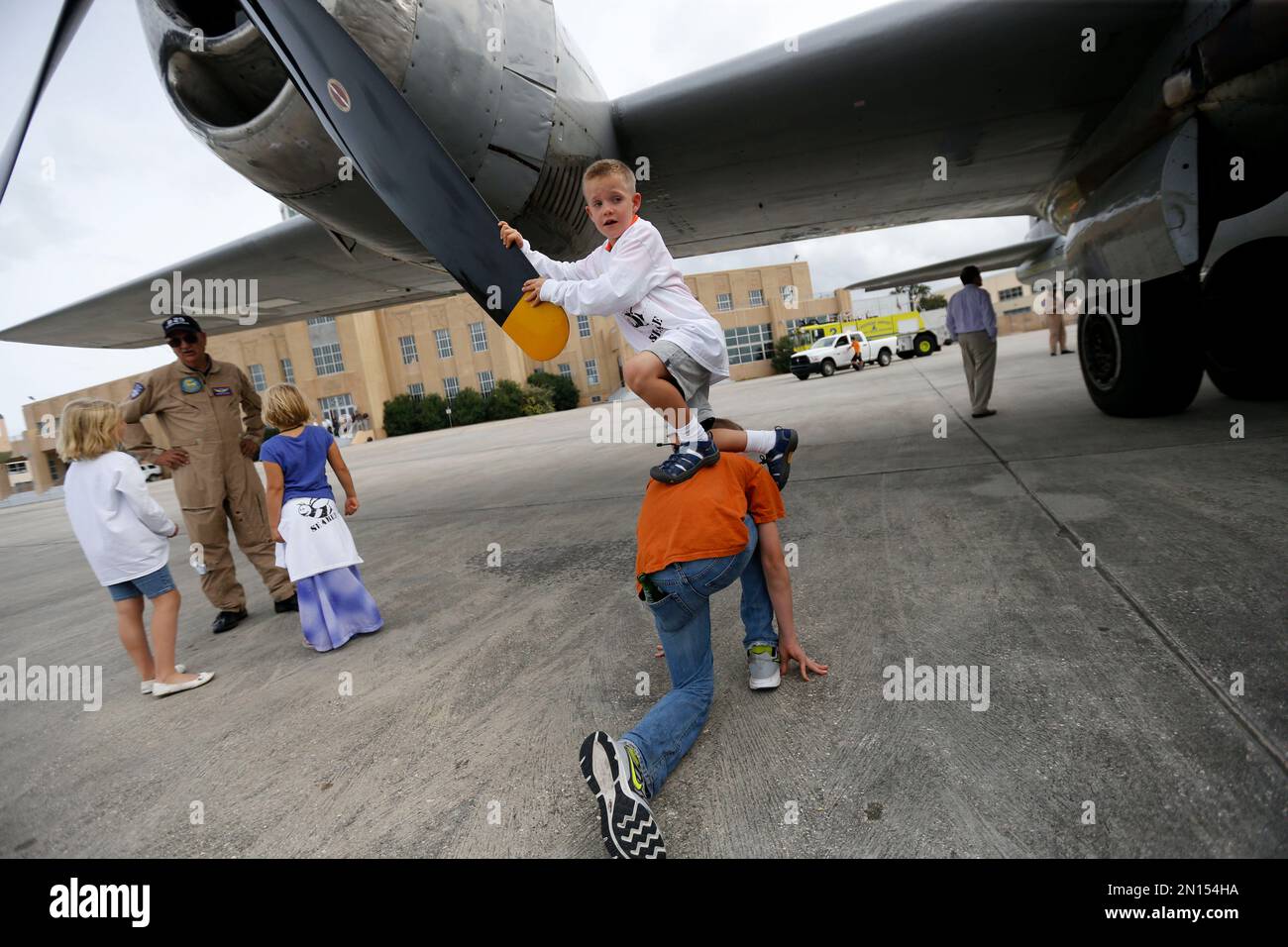 Gabe Adams, 6, climbs on the back of his brother, Jesse Adams,13, great ...