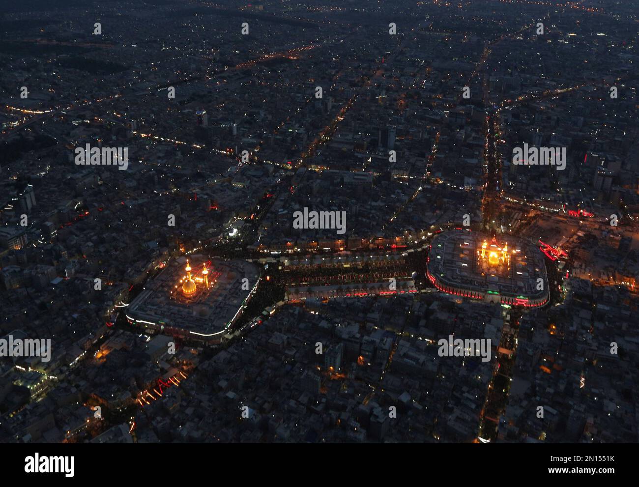 This aerial photo shows Shiite faithful pilgrims gathered between, the ...