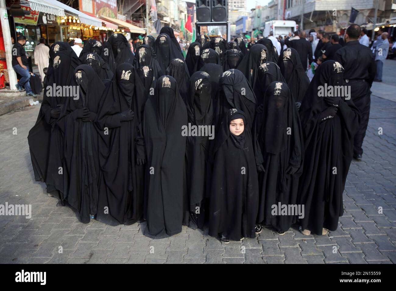 Iraqi Shiite Muslim women gather for the re-enacting of the seventh ...