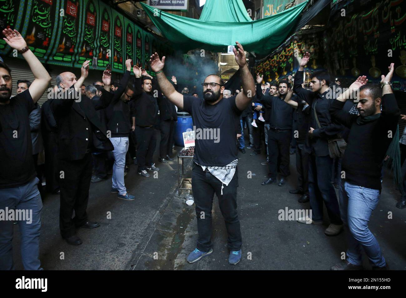 Iranian Shiite Muslims beat their chests during mourning rituals at ...
