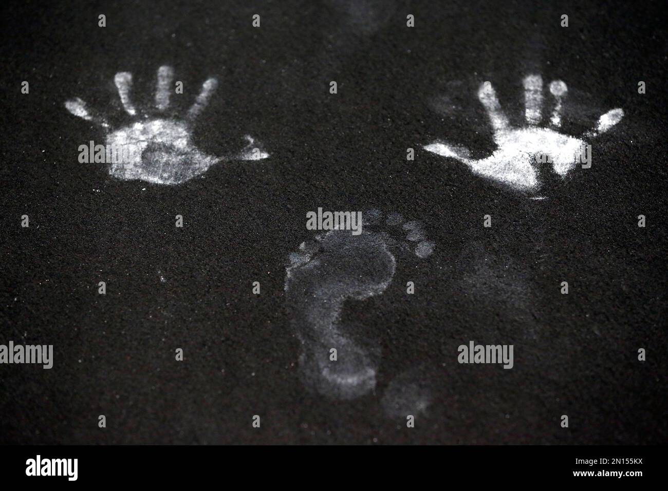 Chalk foot and hand prints pictured on floor during the women's ...