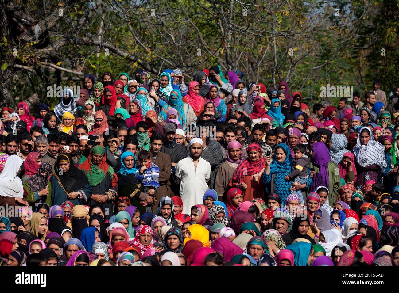 Kashmiri Muslim villagers watch the funeral procession of Irshad Ahmed ...