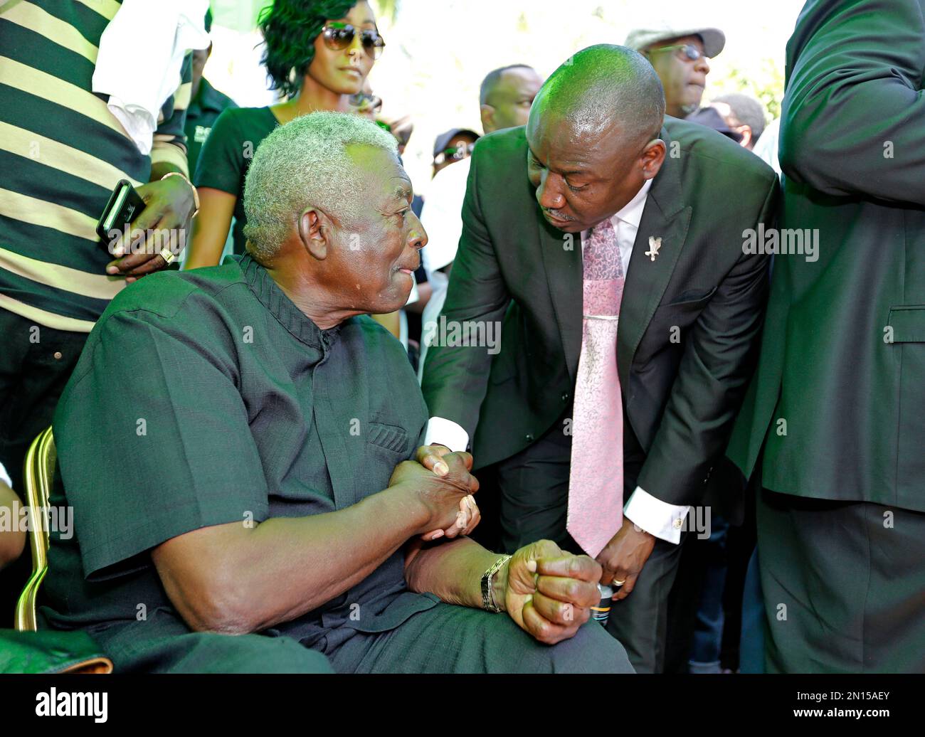 Family attorney Benjamin Crump, right, greets Bishop Sylvester Banks Sr ...