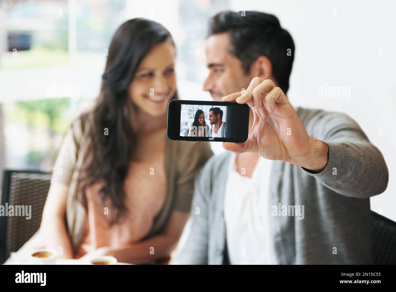 Capturing their courtship. an attractive young couple snapping pictures ...