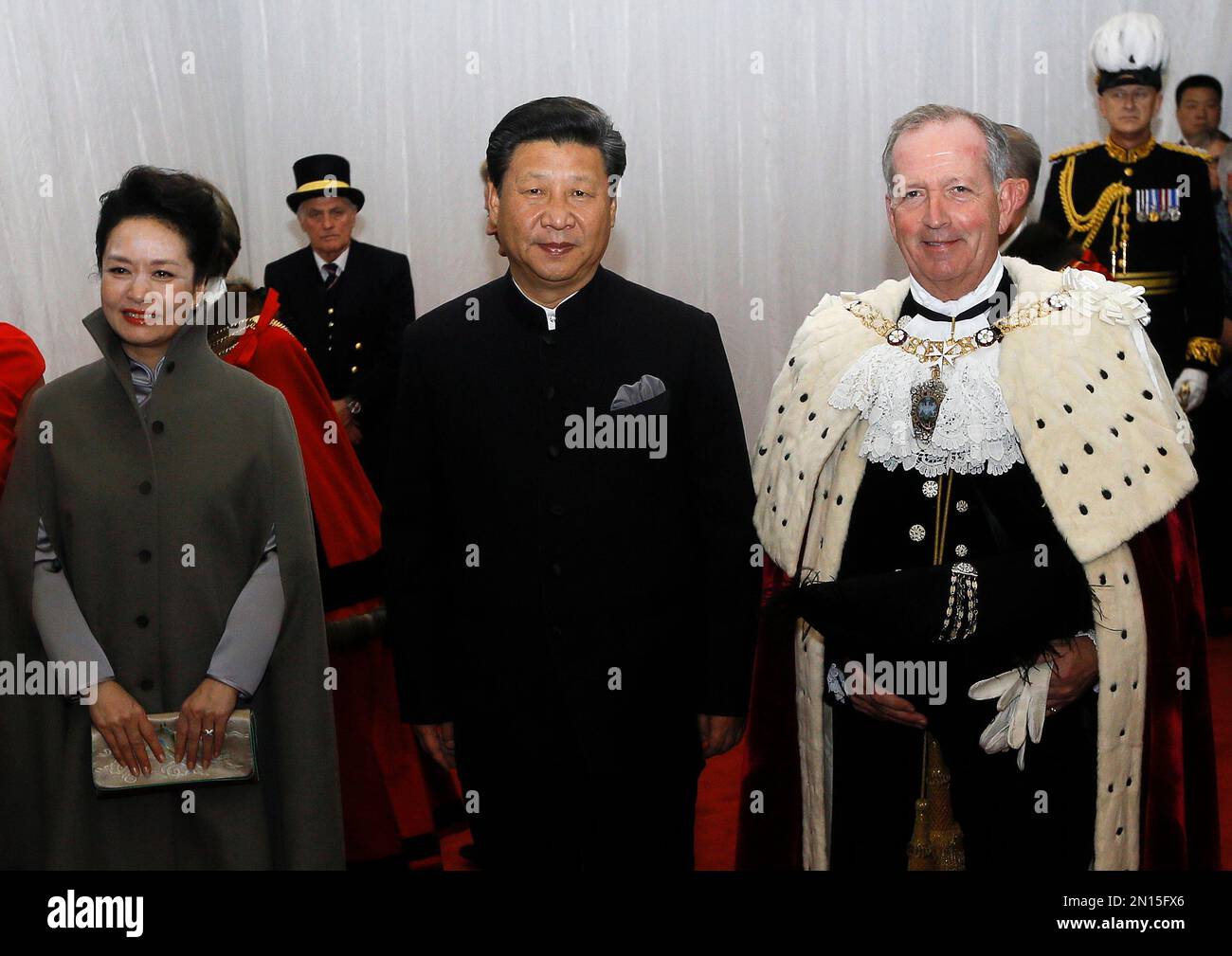Chinese President Xi Jinping, center, and his wife Chinese first lady ...