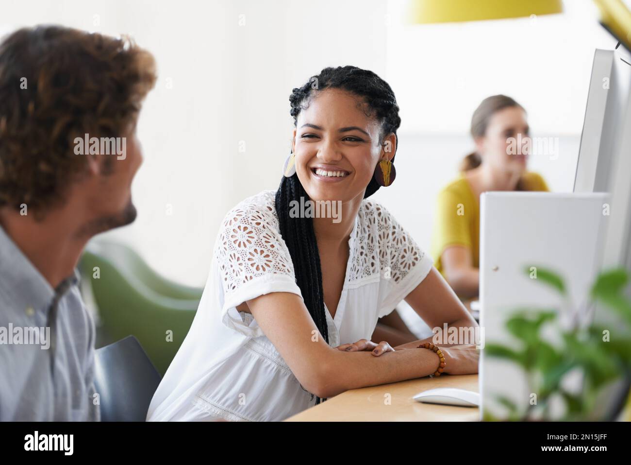 Work is easy with good colleagues. a team of designers talking while ...