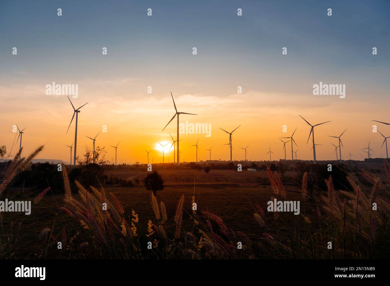Field of wind turbines on the hill at sunset To produce clean ...