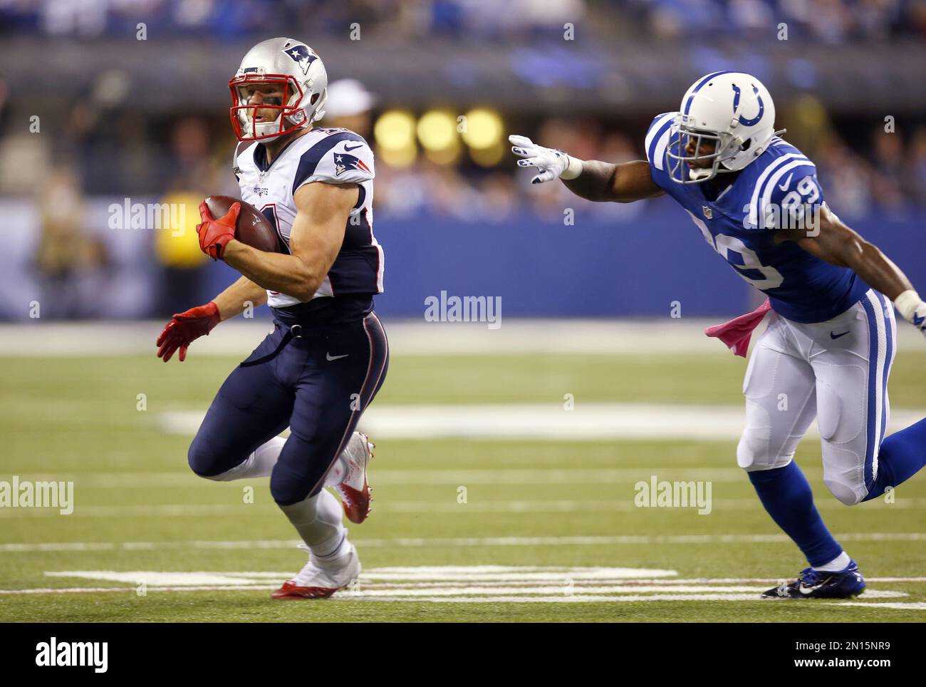 New England Patriots wide receiver Julian Edelman (11) tries to avoid ...