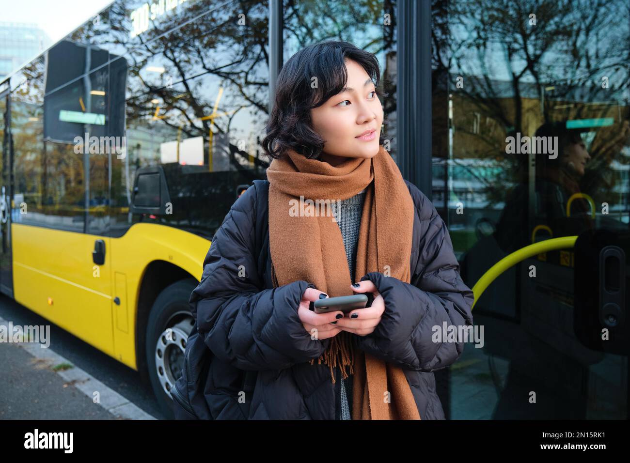 Portrait of korean girl buying ticket for public transport online ...