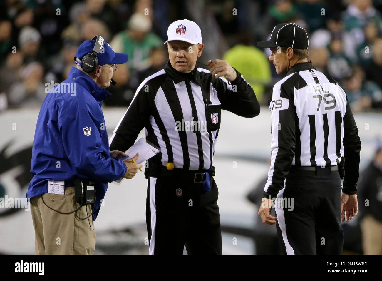 New York Giants head coach Tom Coughlin, left, talks to referee Carl ...
