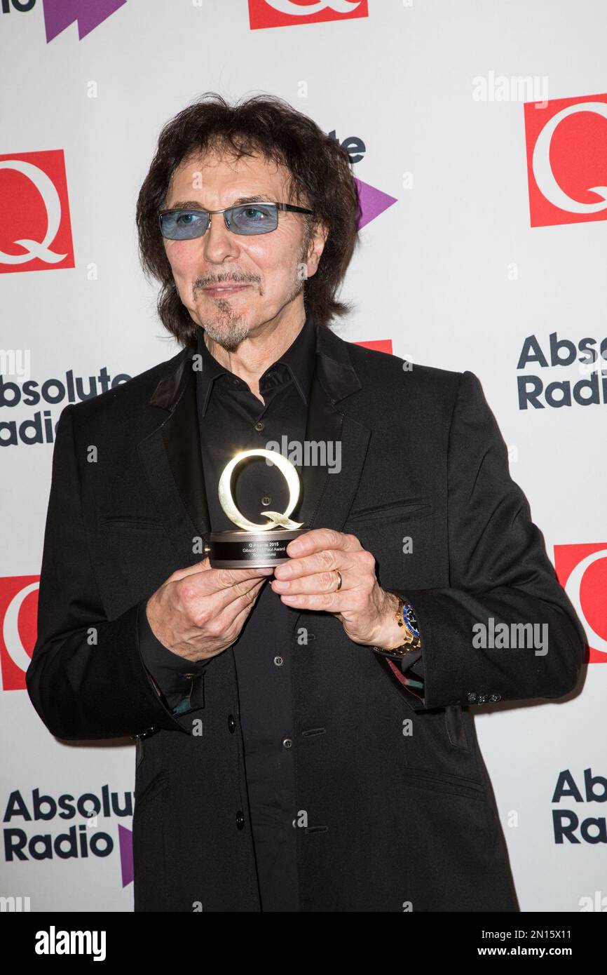 Tony Iommi poses for photographers after receiving the Gibson Les Paul ...