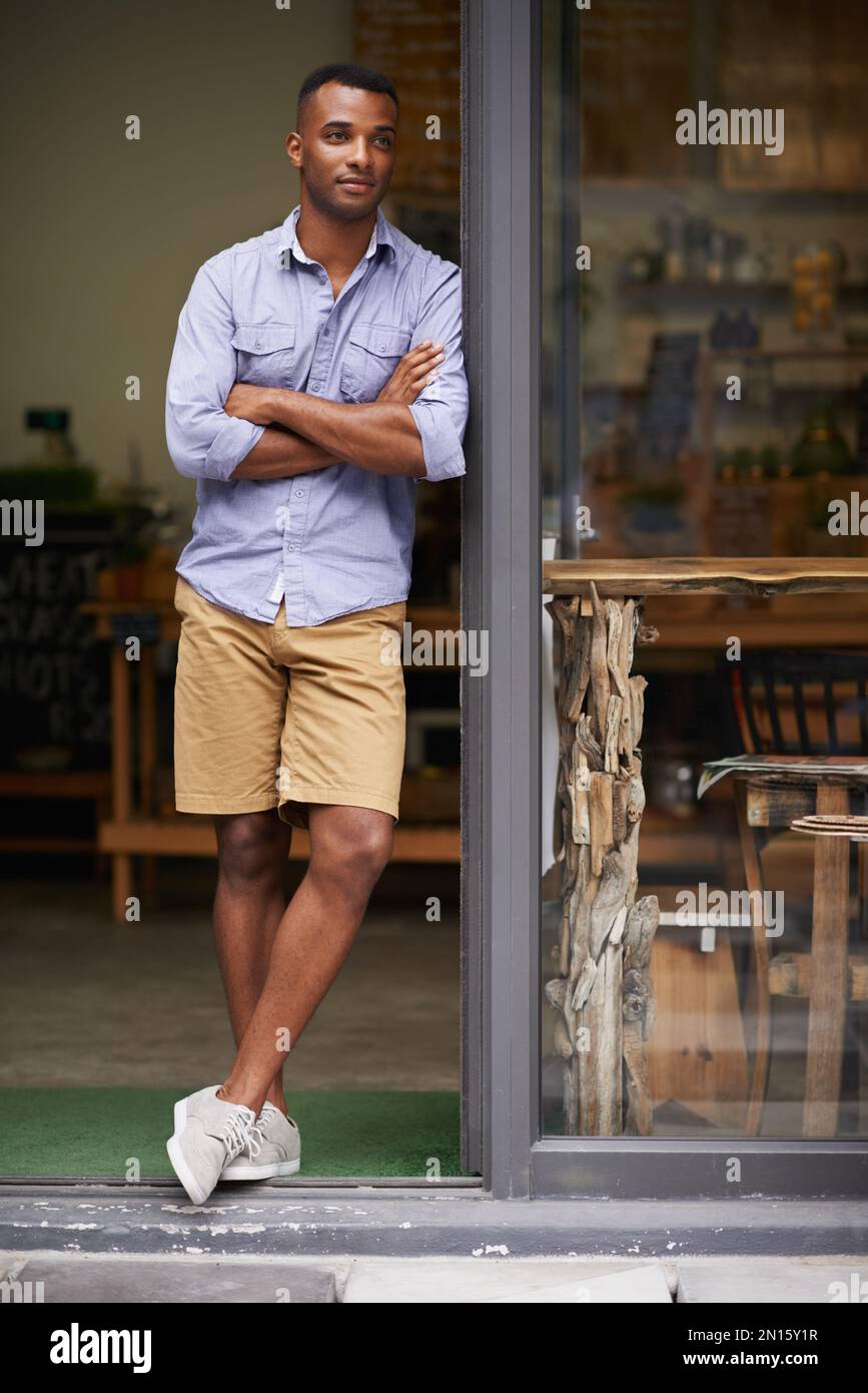 Care to come in. A handsome young man standing in the entrance to his ...
