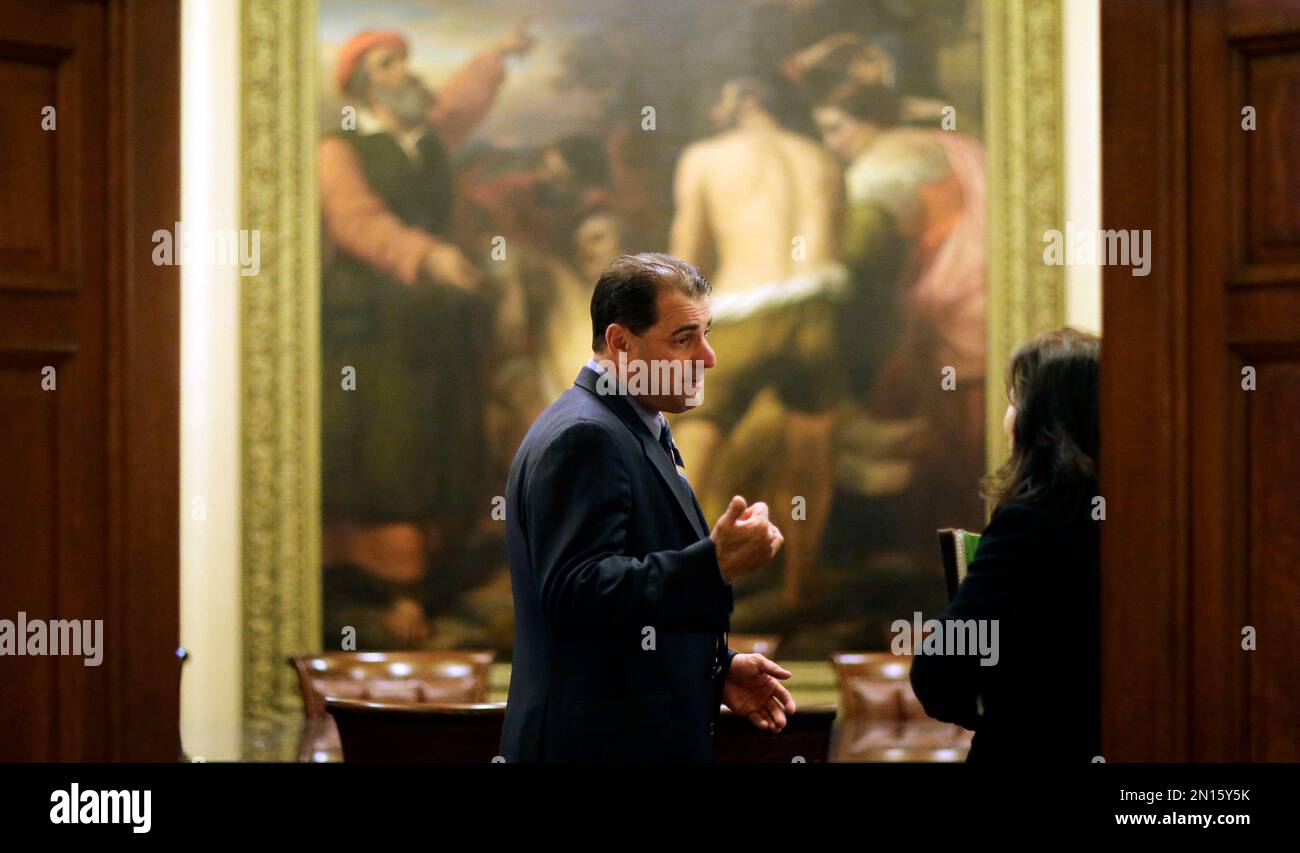 New Jersey Sen. Paul Sarlo, D-Wood-Ridge, N.J., stands near a large ...