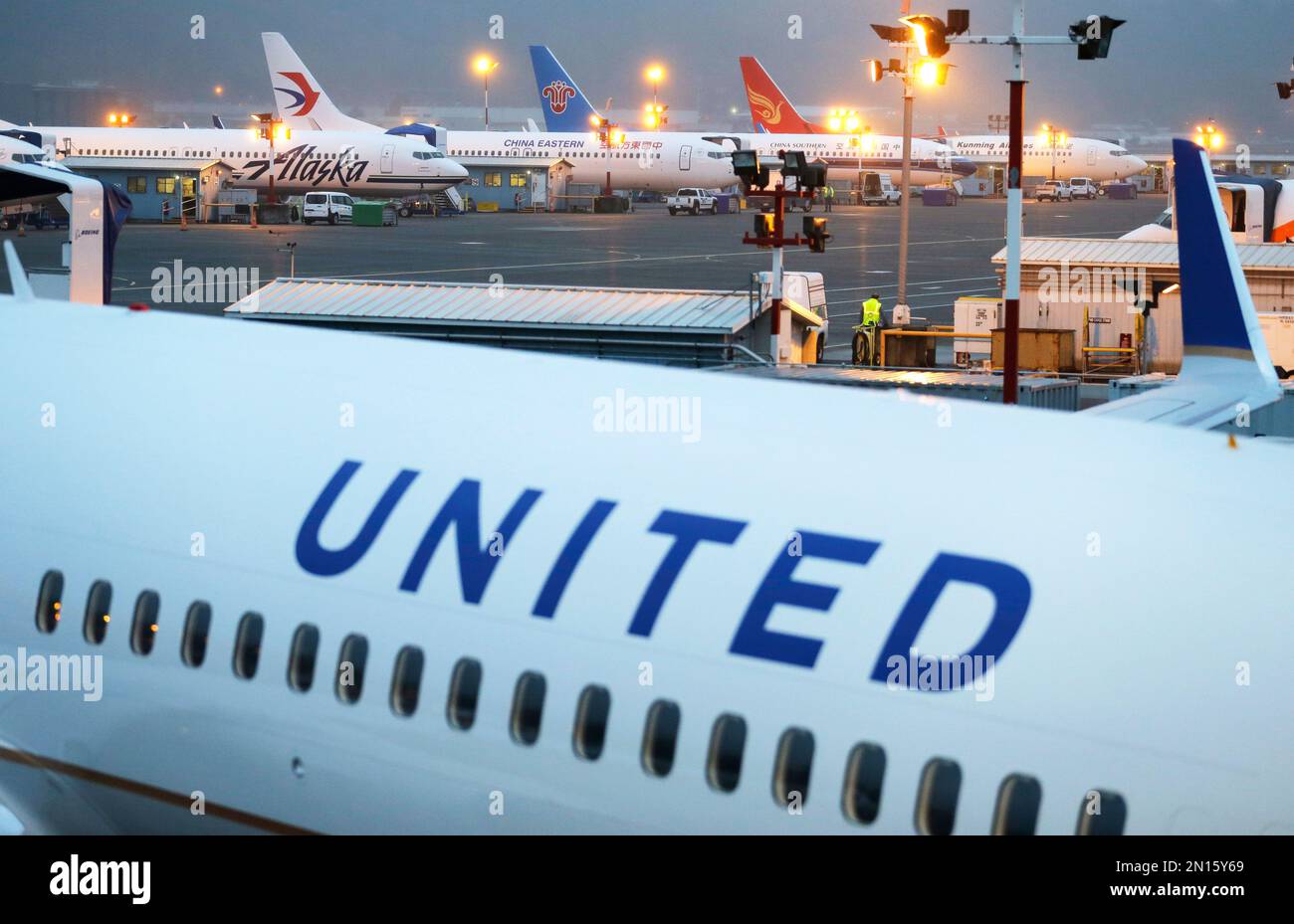 Boeing 737 airplanes sit parked along the flight line near Boeing's ...