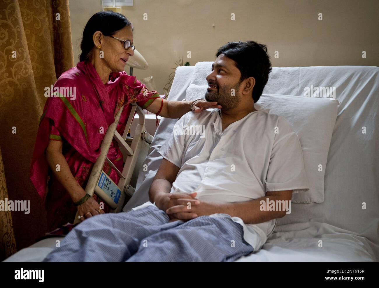 In this Tuesday, Oct. 13, 2015 photo, Pushplata Sharma, left, mother of Tejaswi Sharma, a 34 ...