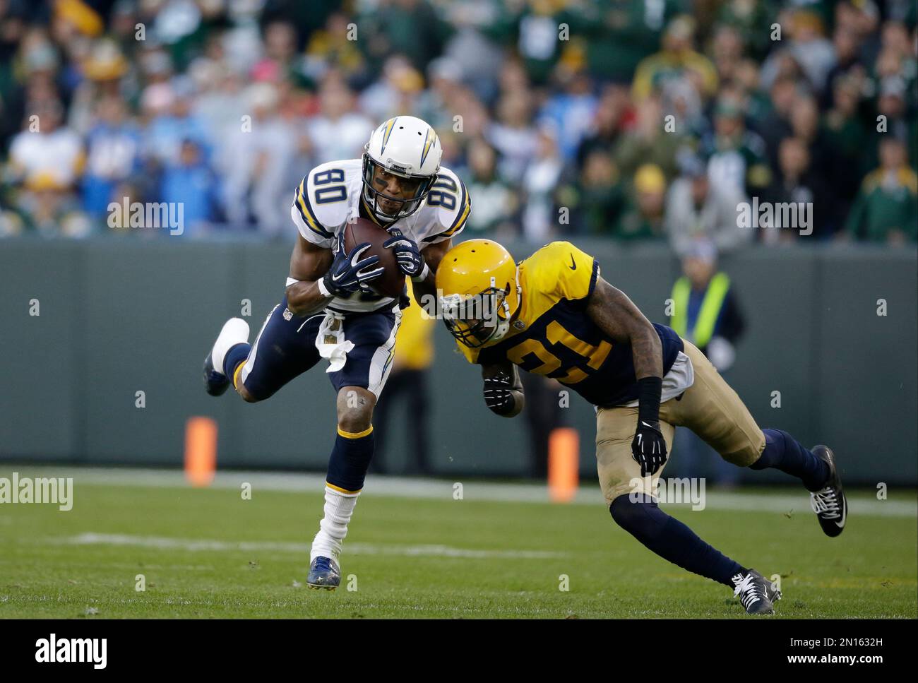 San Diego Chargers' Malcom Floyd (80) is tackled Green Bay Packers' Ha ...