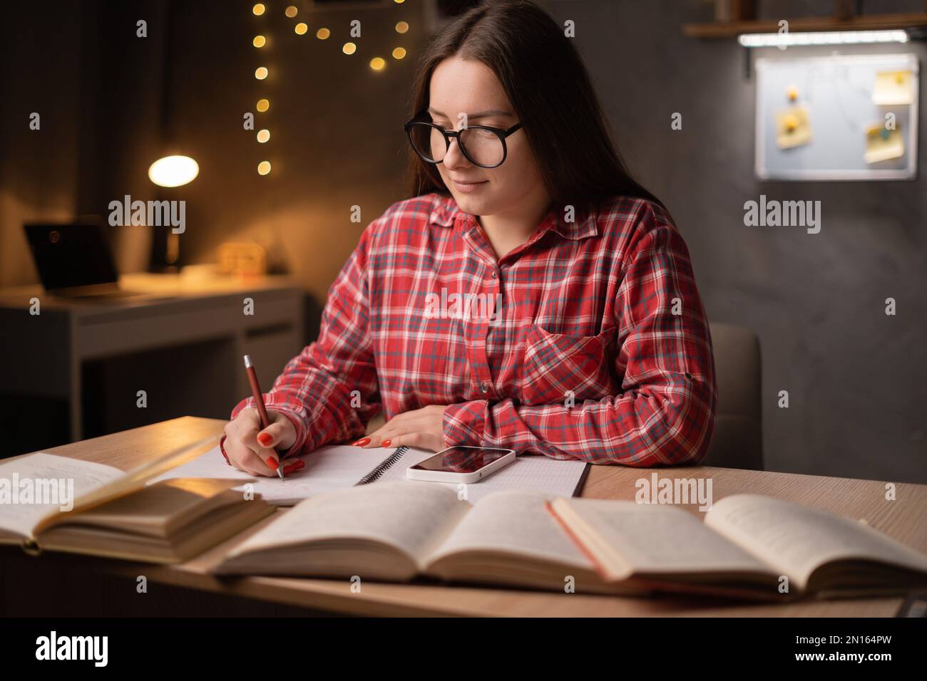 Remote learning. Female student prepare for exam at home or dormitory ...