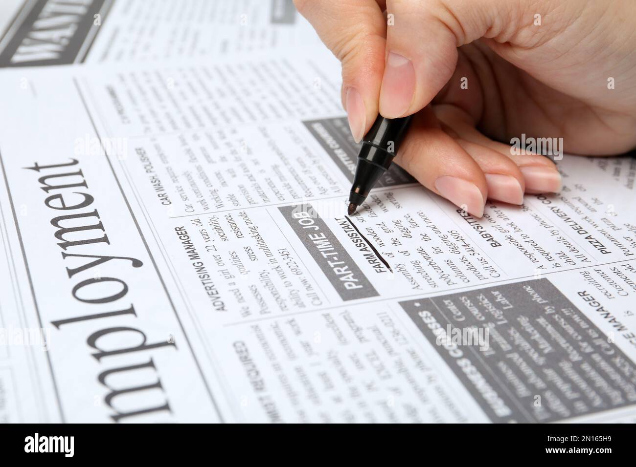 Woman marking advertisement in newspaper, closeup. Job search concept Stock Photo - Alamy