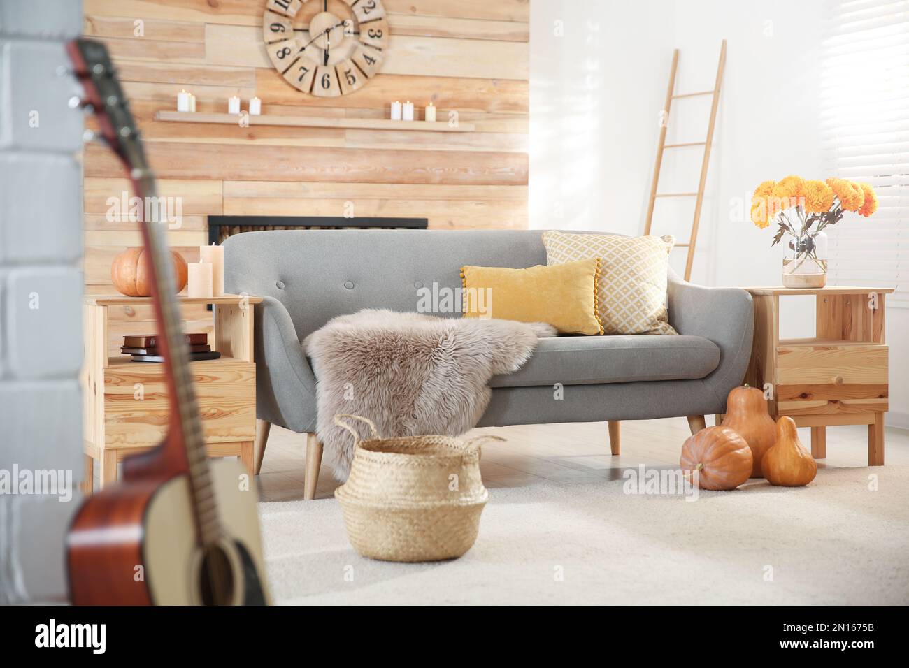 Cozy living room interior inspired by autumn colors Stock Photo - Alamy