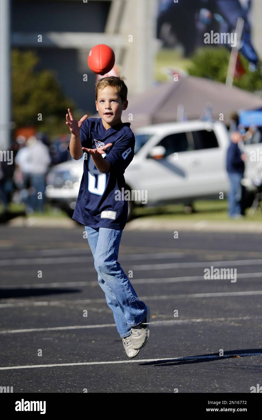 Cole Romine, 8, catches a football outside Nissan Stadium before an NFL ...
