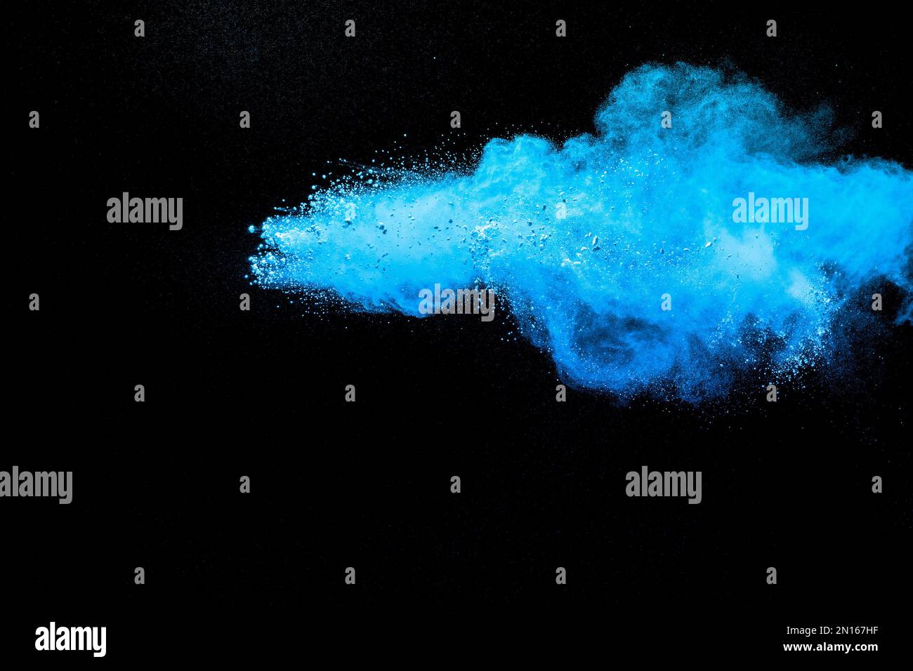 Blue powder explosion cloud on black background.Launched blue dust ...