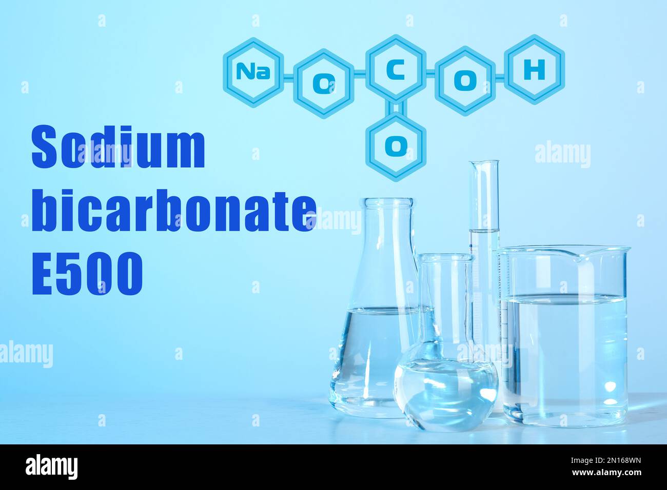 Text Sodium bicarbonate E500 with soda formula and laboratory glassware ...