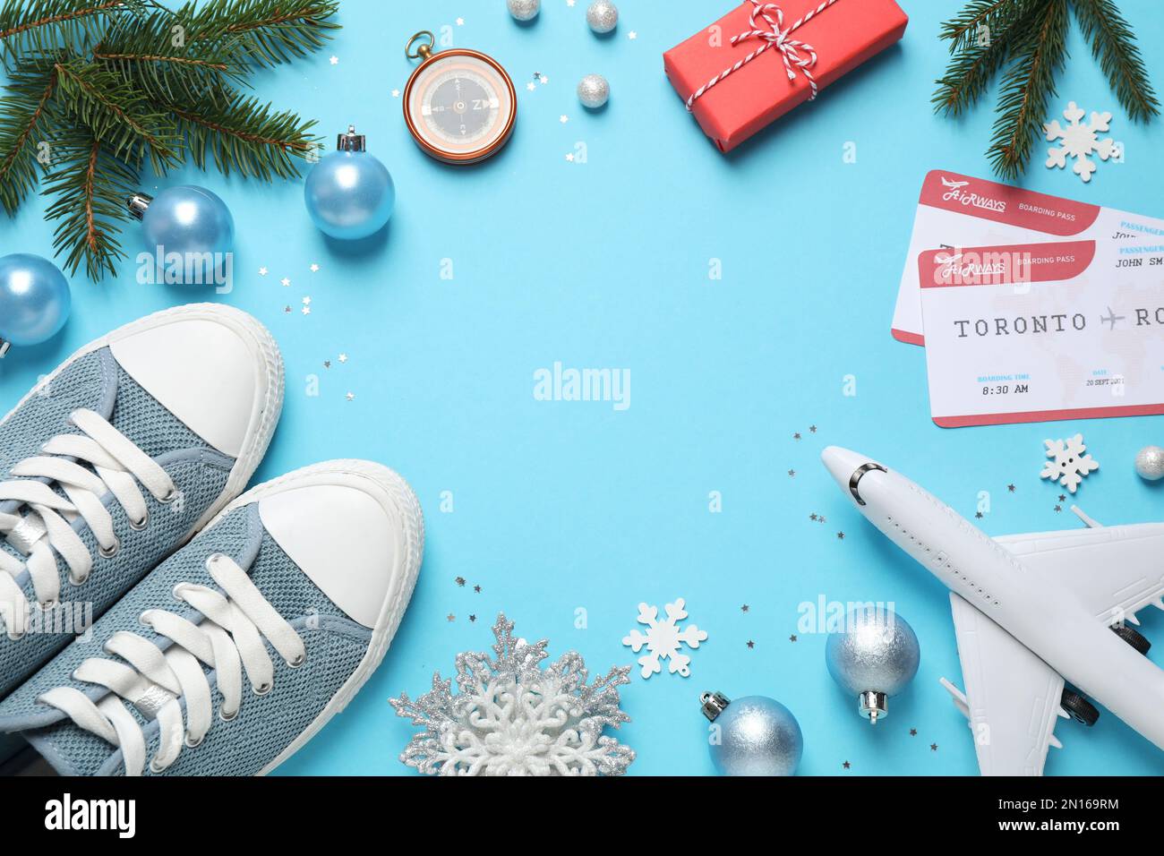 Frame of Christmas decorations, airline tickets and space for text on ...