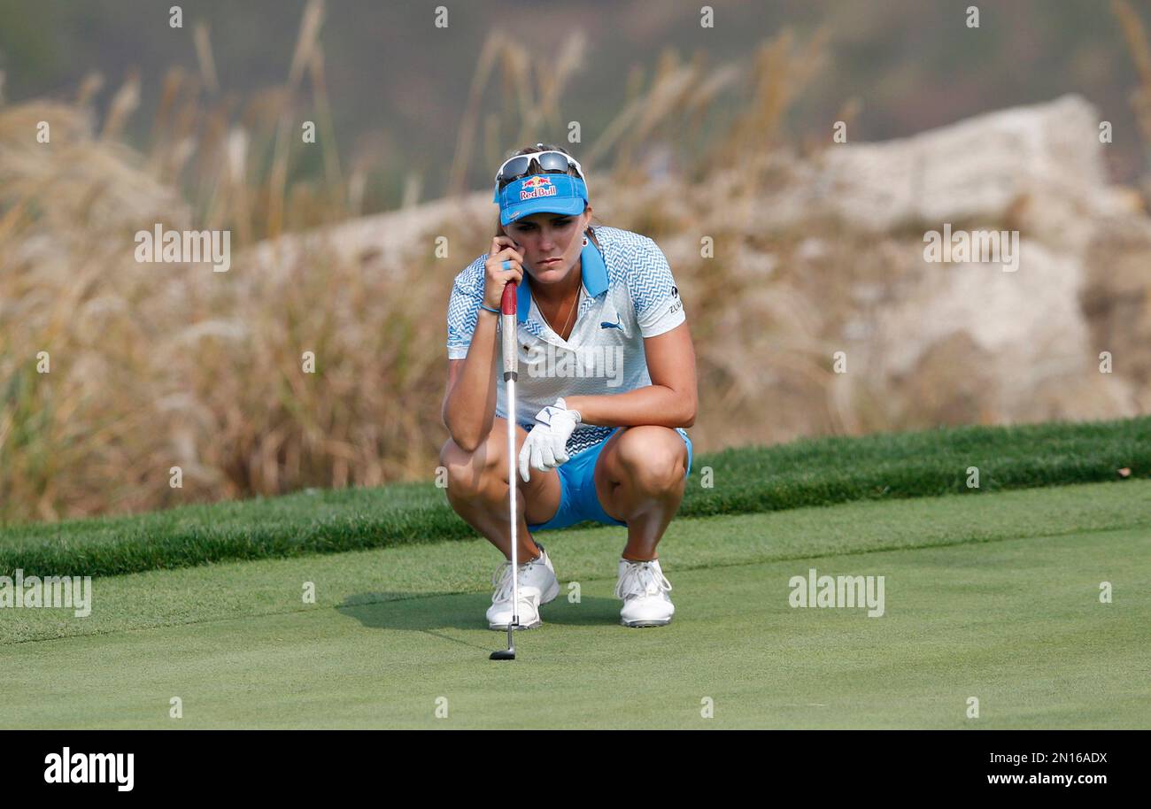 Lexi Thompson of the United States lines up her putt on the sixth hole ...
