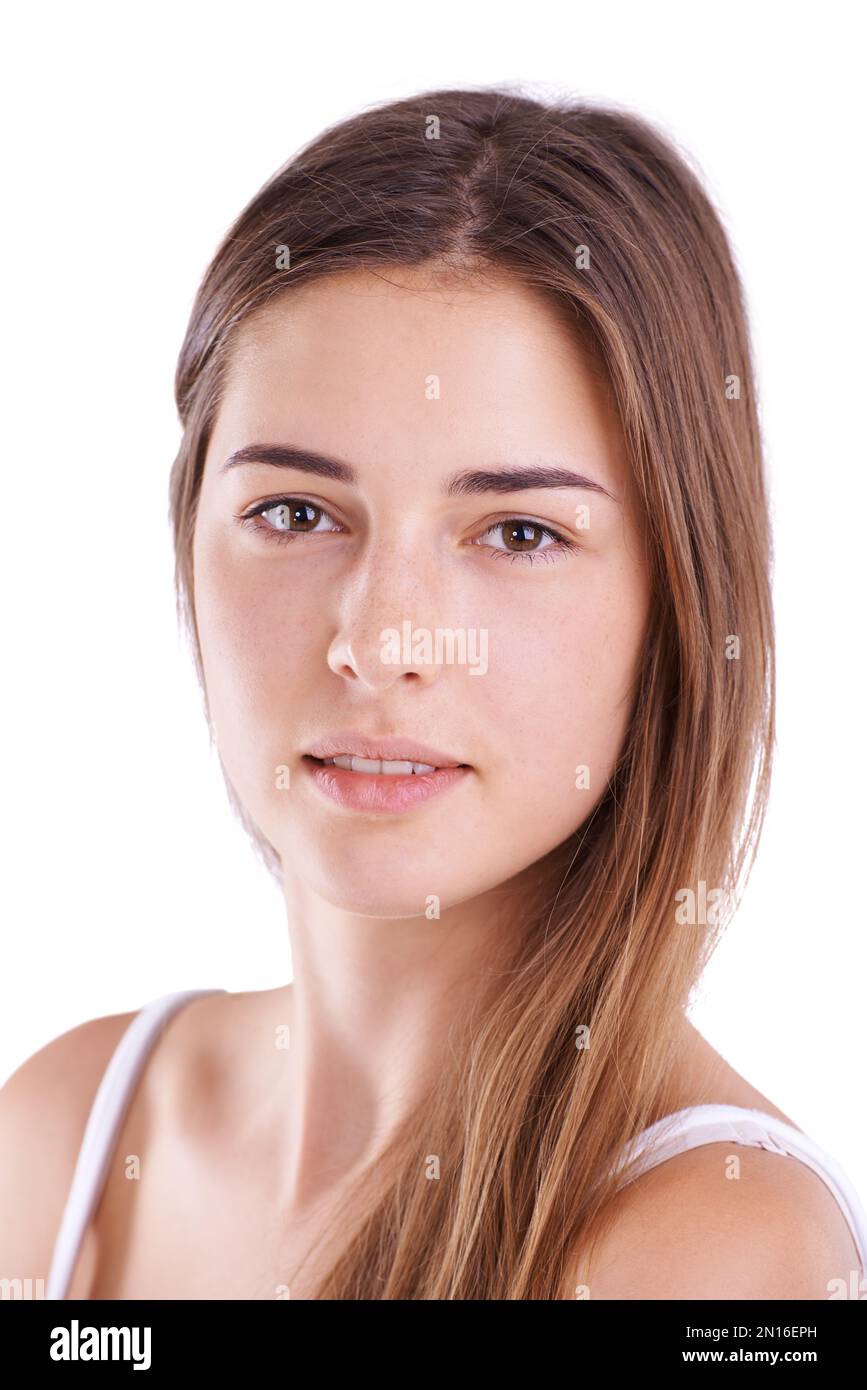 Effortless beauty. Studio portrait of a beautiful young woman isolated ...