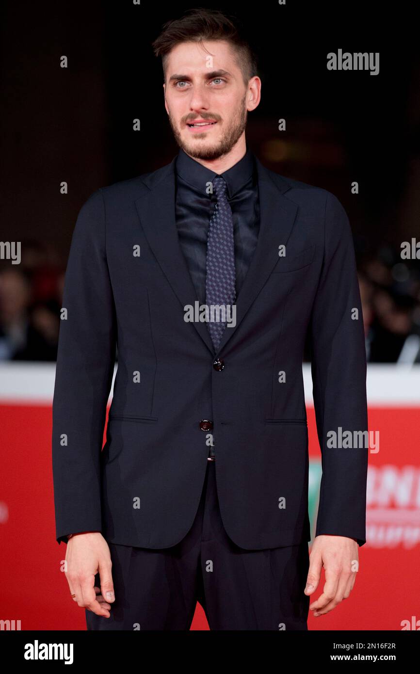 Actor Luca Marinelli poses for photos as he arrives for the screening ...